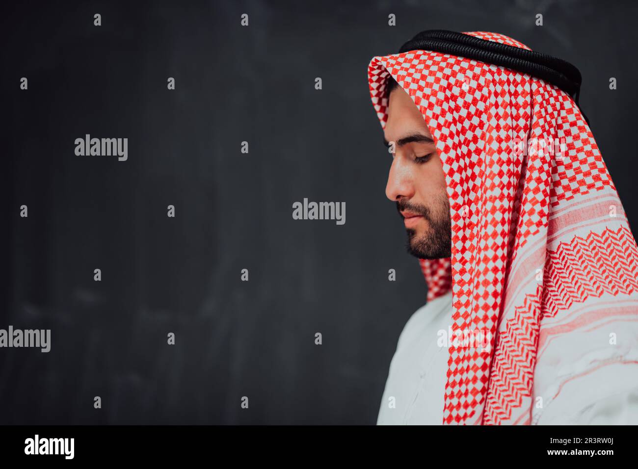 Arabian man in traditional clothes making traditional prayer to God ...