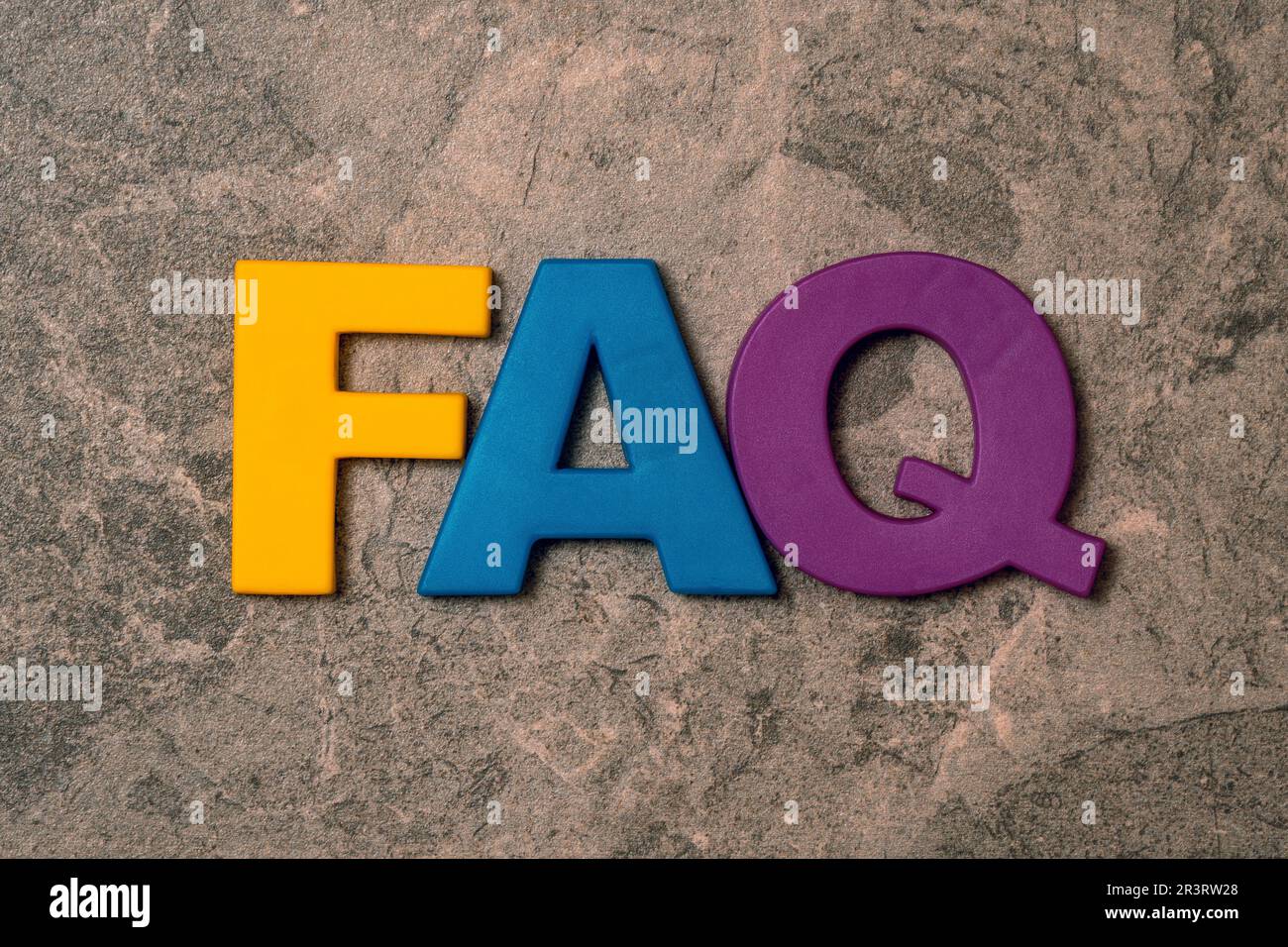 FAQ symbol on the stone background Stock Photo - Alamy