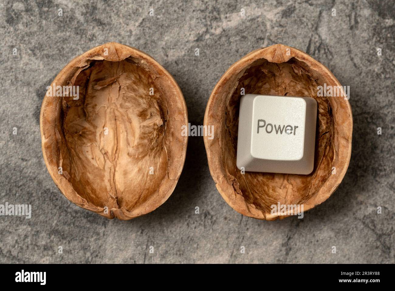 Computer POWER button inside cracked walnut shell Stock Photo - Alamy