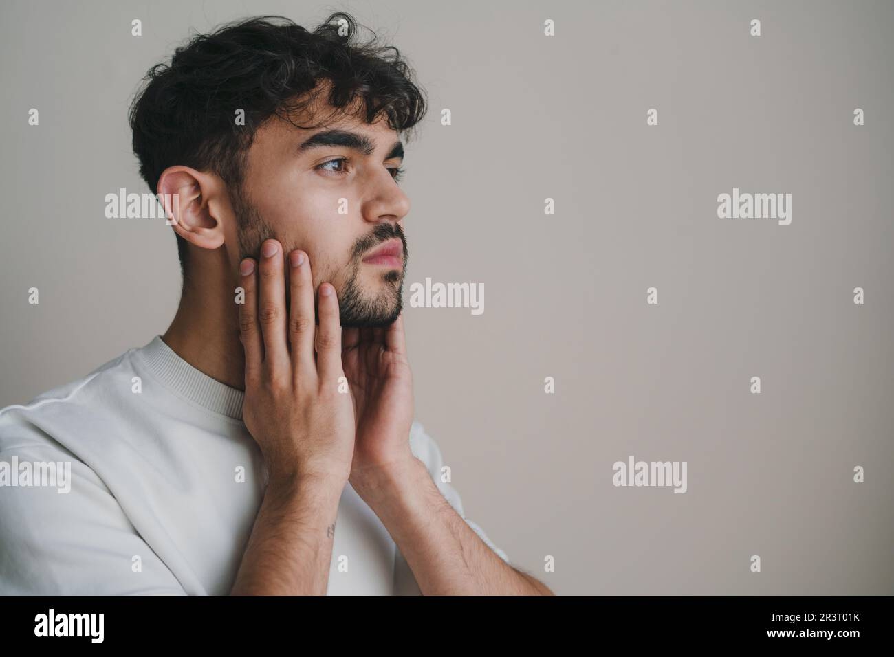 Side view photo touching perfect skin face with hands looking away ...