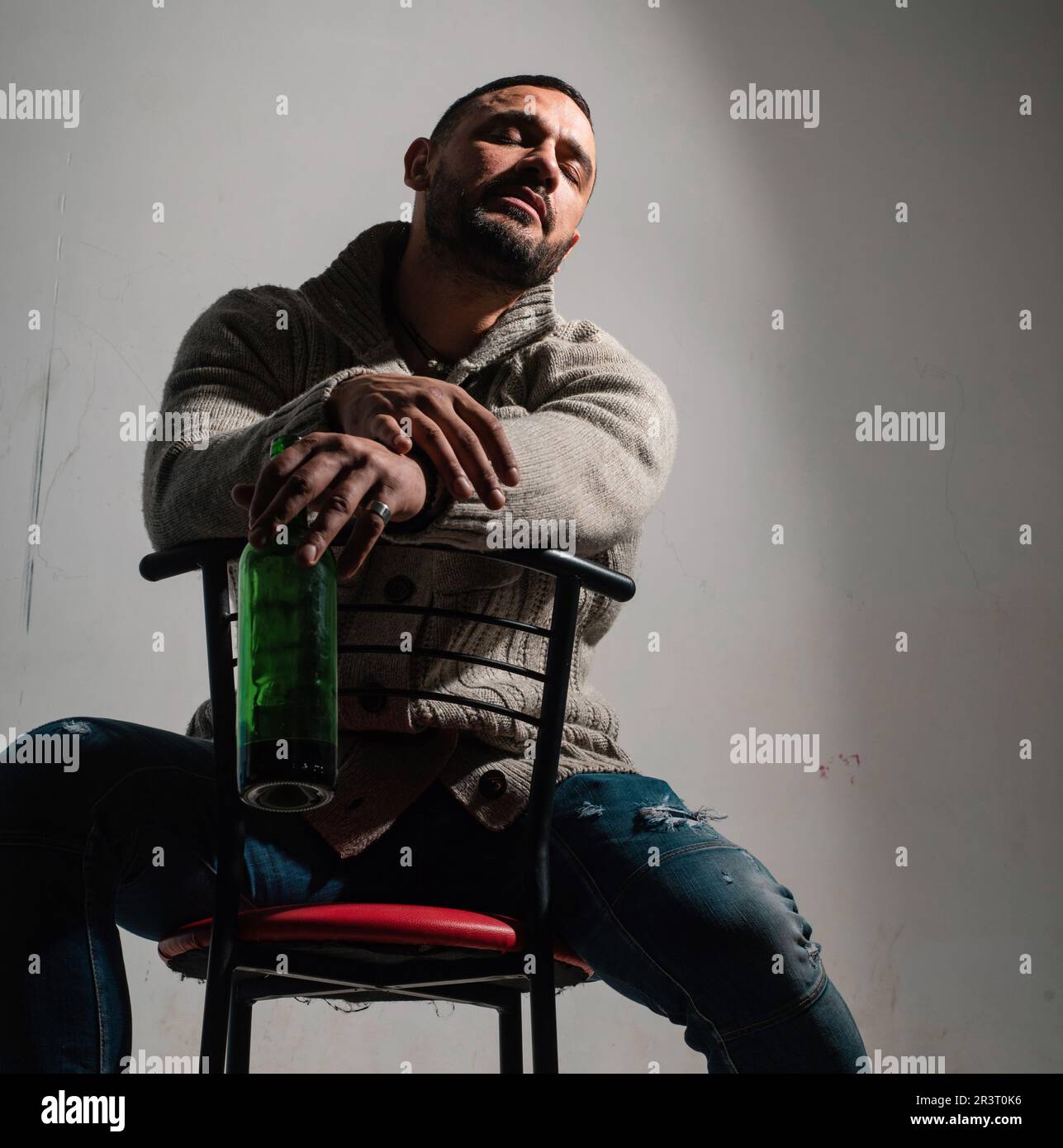 Alcoholic man with bottles wine cry. Depressed crying man. Hangover ...