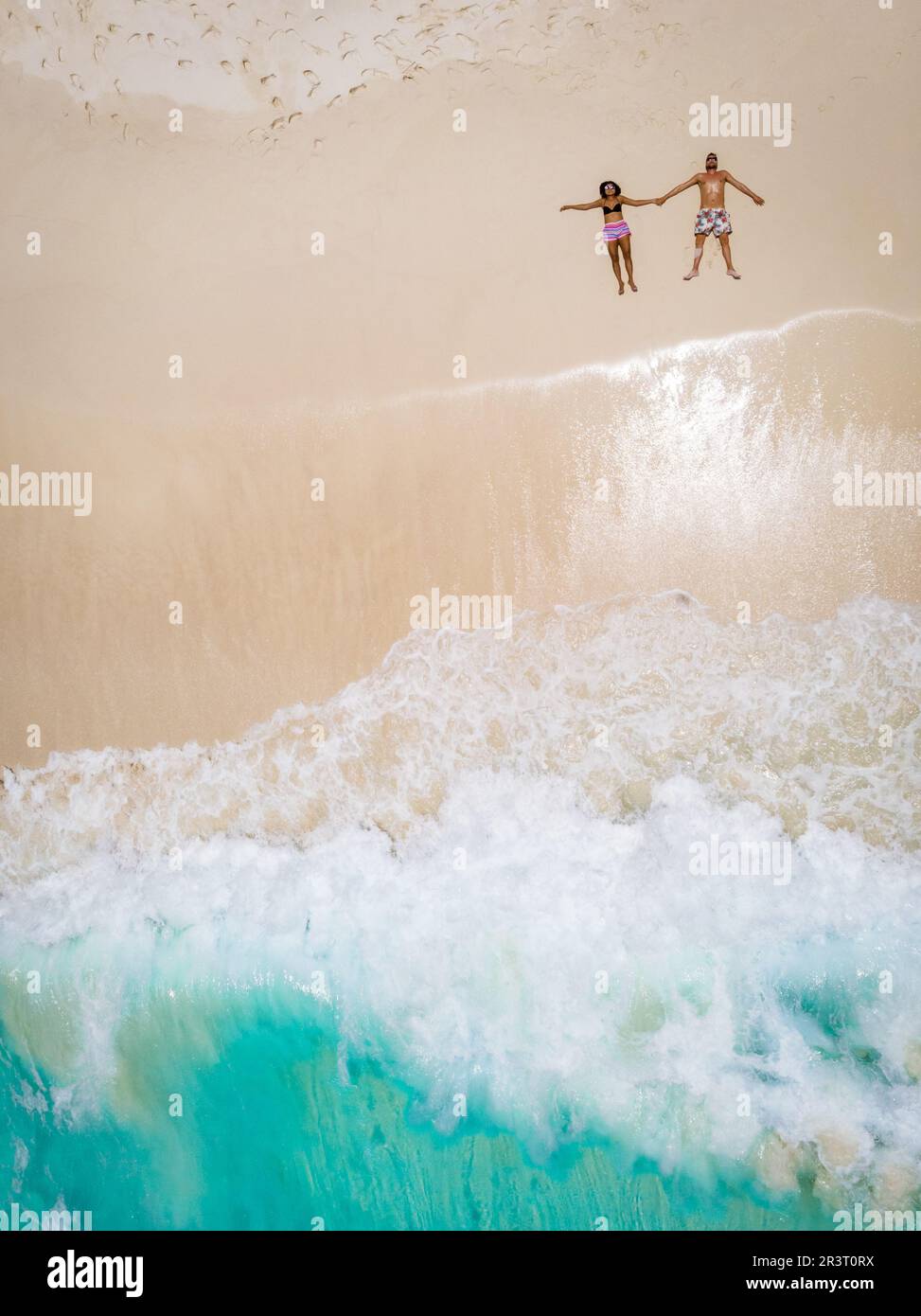 Woman beach top view laying hi-res stock photography and images - Alamy