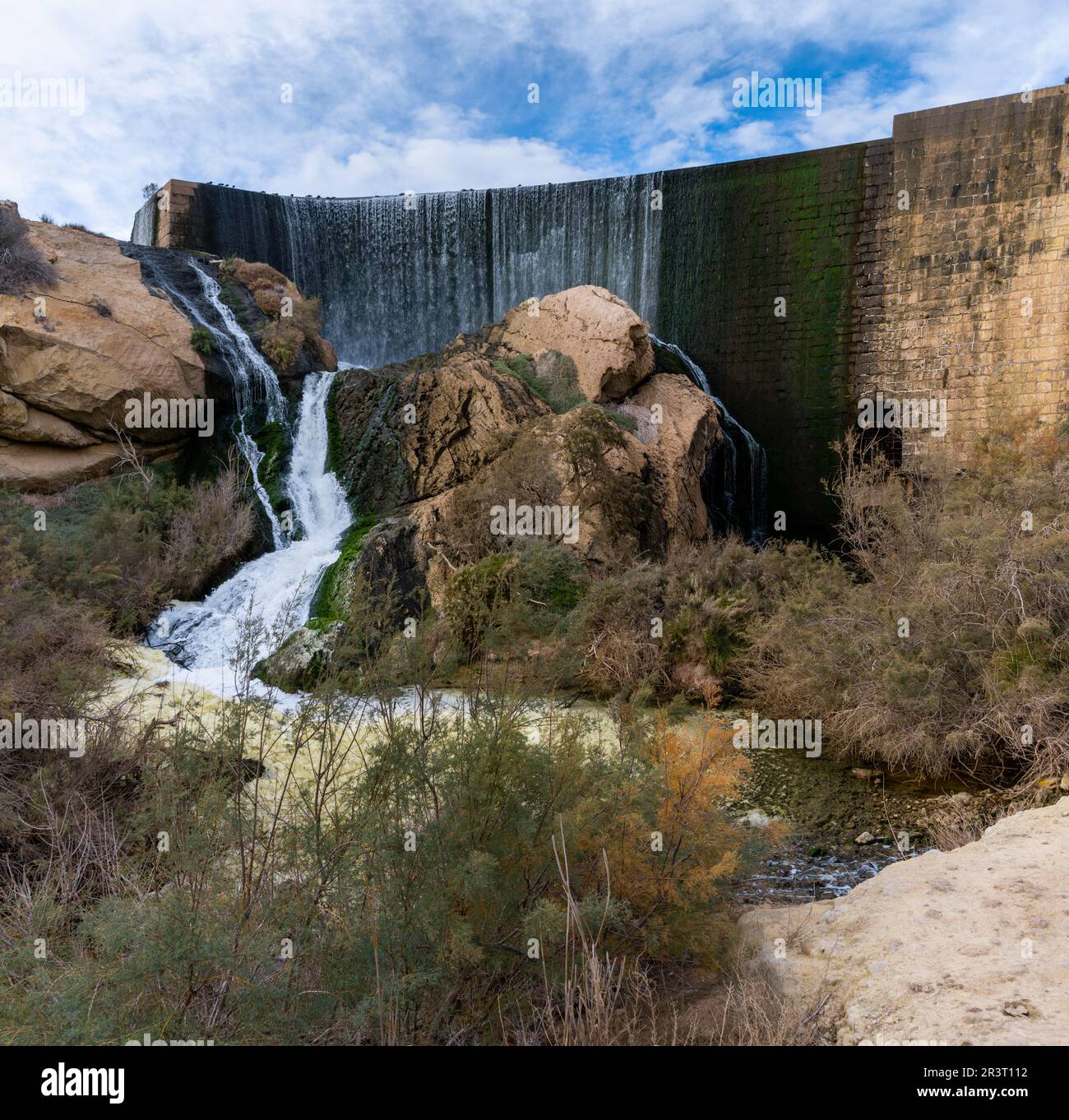 View of the waterfall and overflow of the dam wall of the Elche ...