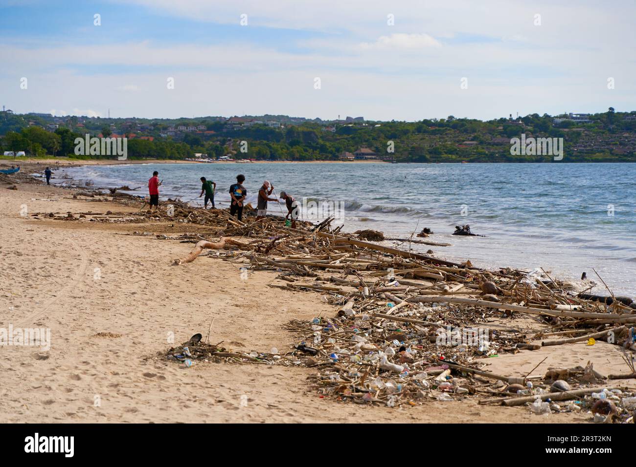 Mountains of waste and garbage on the sandy beach after the tide ...