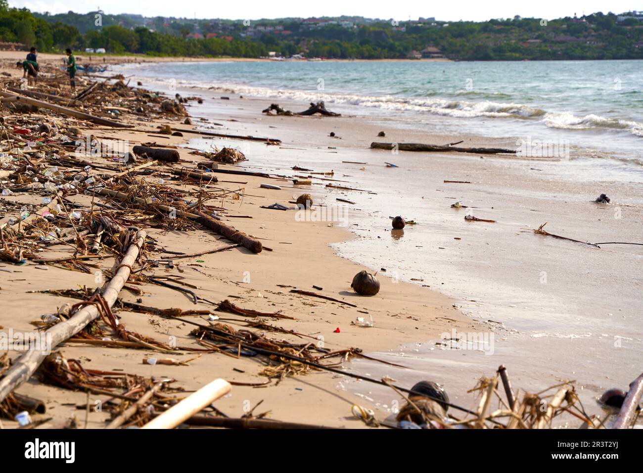 Mountains of waste and garbage on the sandy beach after the tide ...