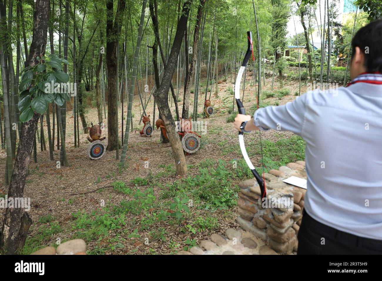 Longyou, China's Zhejiang Province. 24th May, 2023. A tourist tries ...