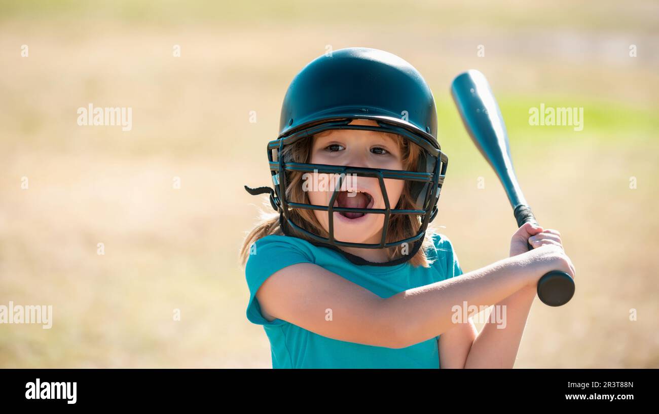 Kid baseball ready to bat. Child batter about to hit a pitch during a ...