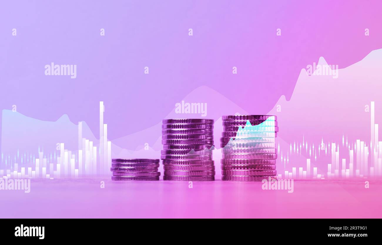 A stack of metallic coins and a chart with growing rates. High income ...