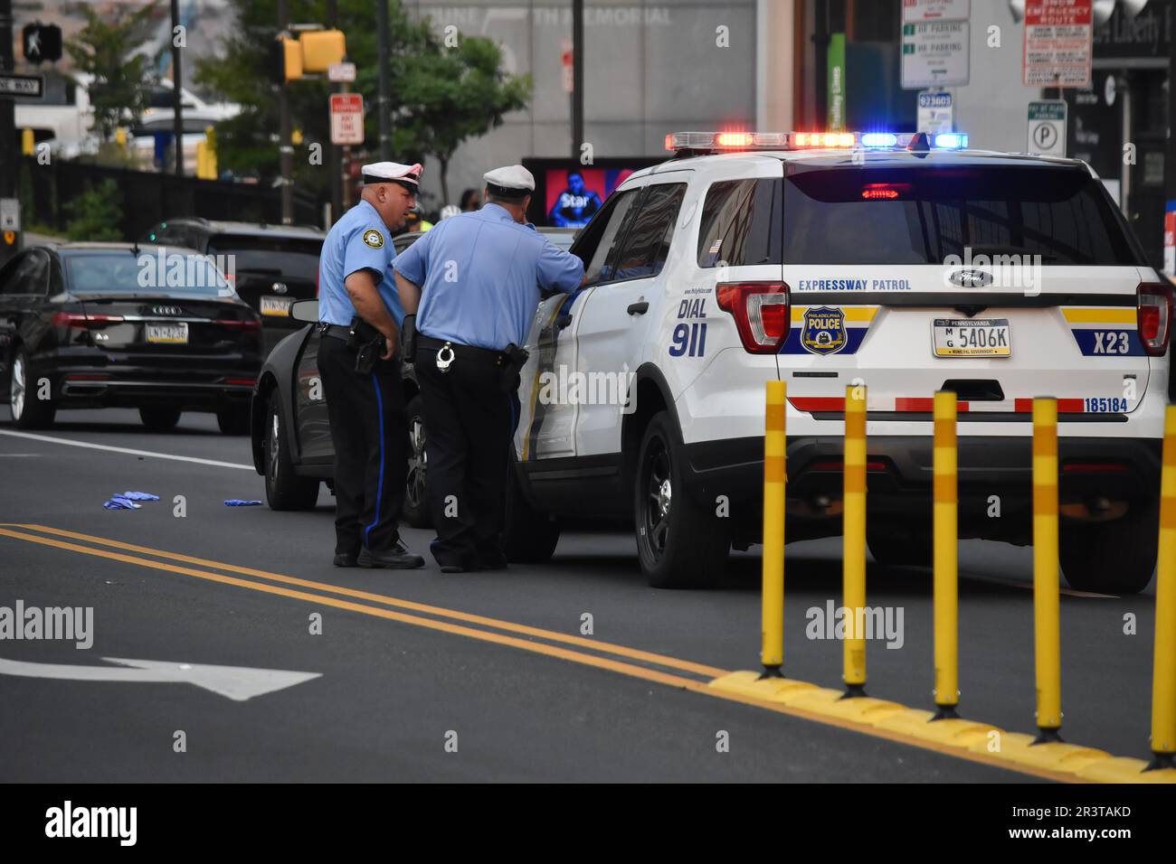 Philadelphia police officers investigate the scene. Road rage incident ...