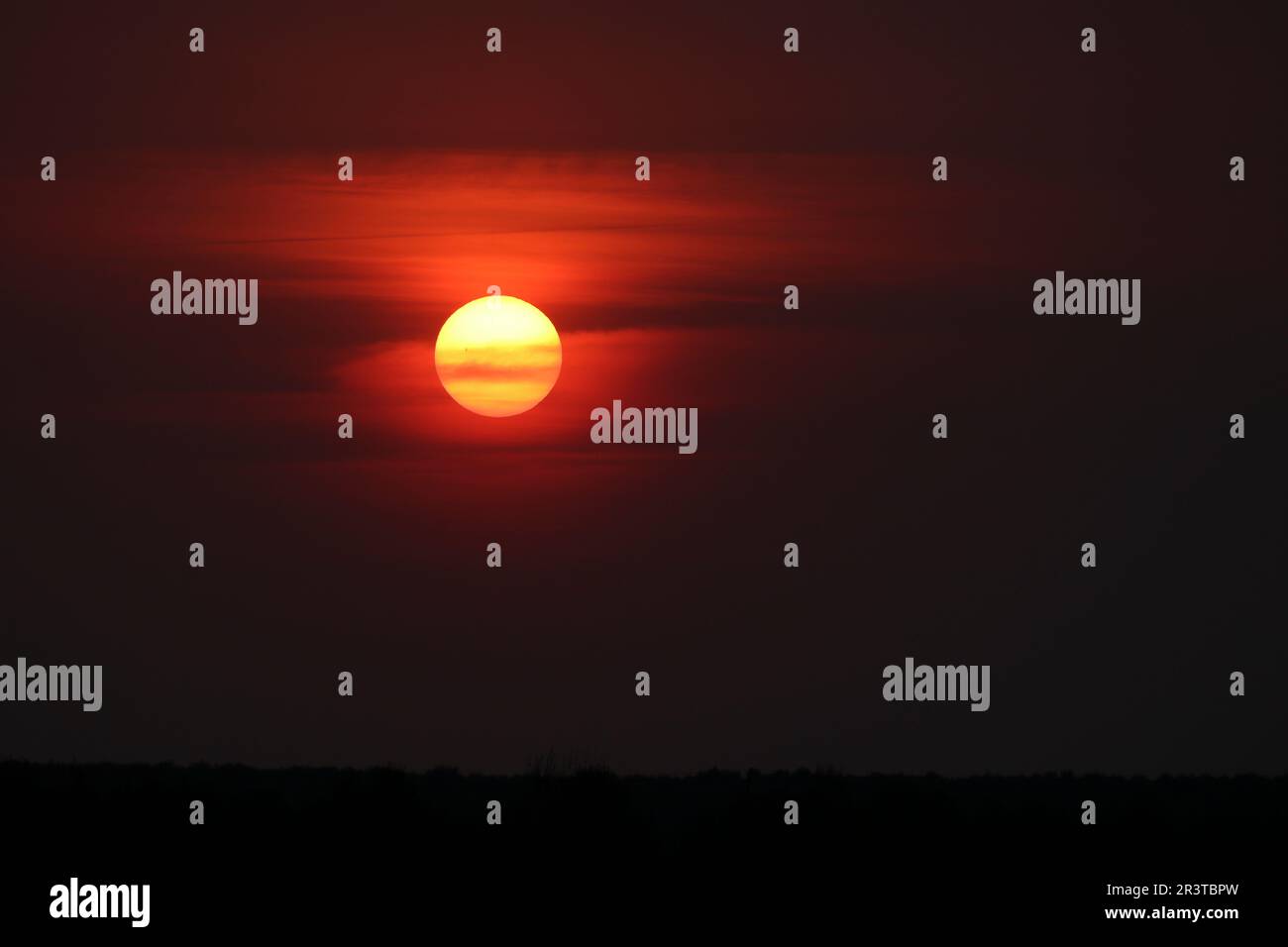 Romantic sunset, dramatic background, red sun with spots Stock Photo ...