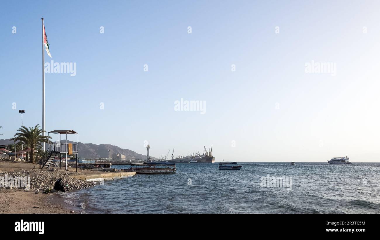 Sunset at Aqaba beach, Jordan's window on the Red Sea. In the ...