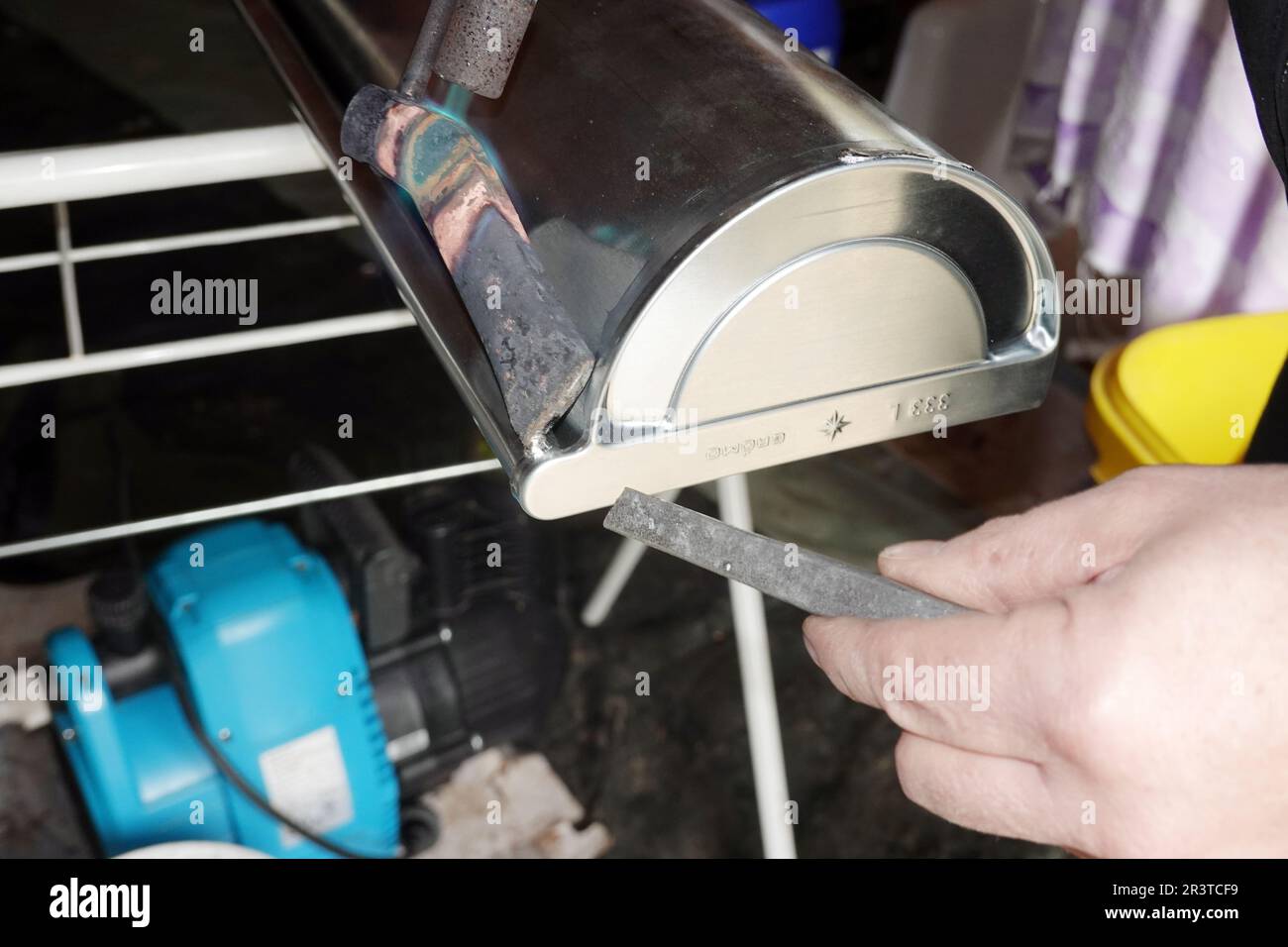 Gutter end piece is soldered to a new gutter Stock Photo - Alamy
