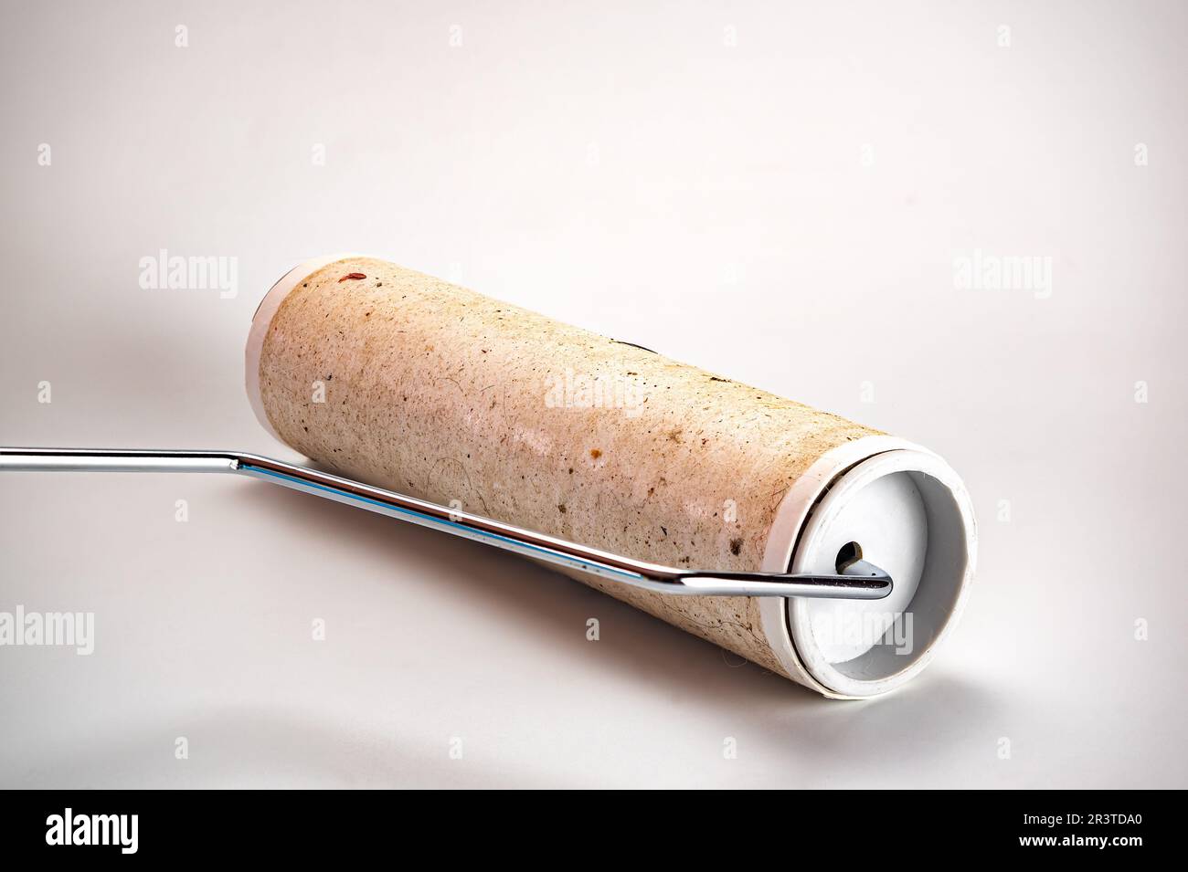 View of dirty used sticky remover roller with different kinds of ...