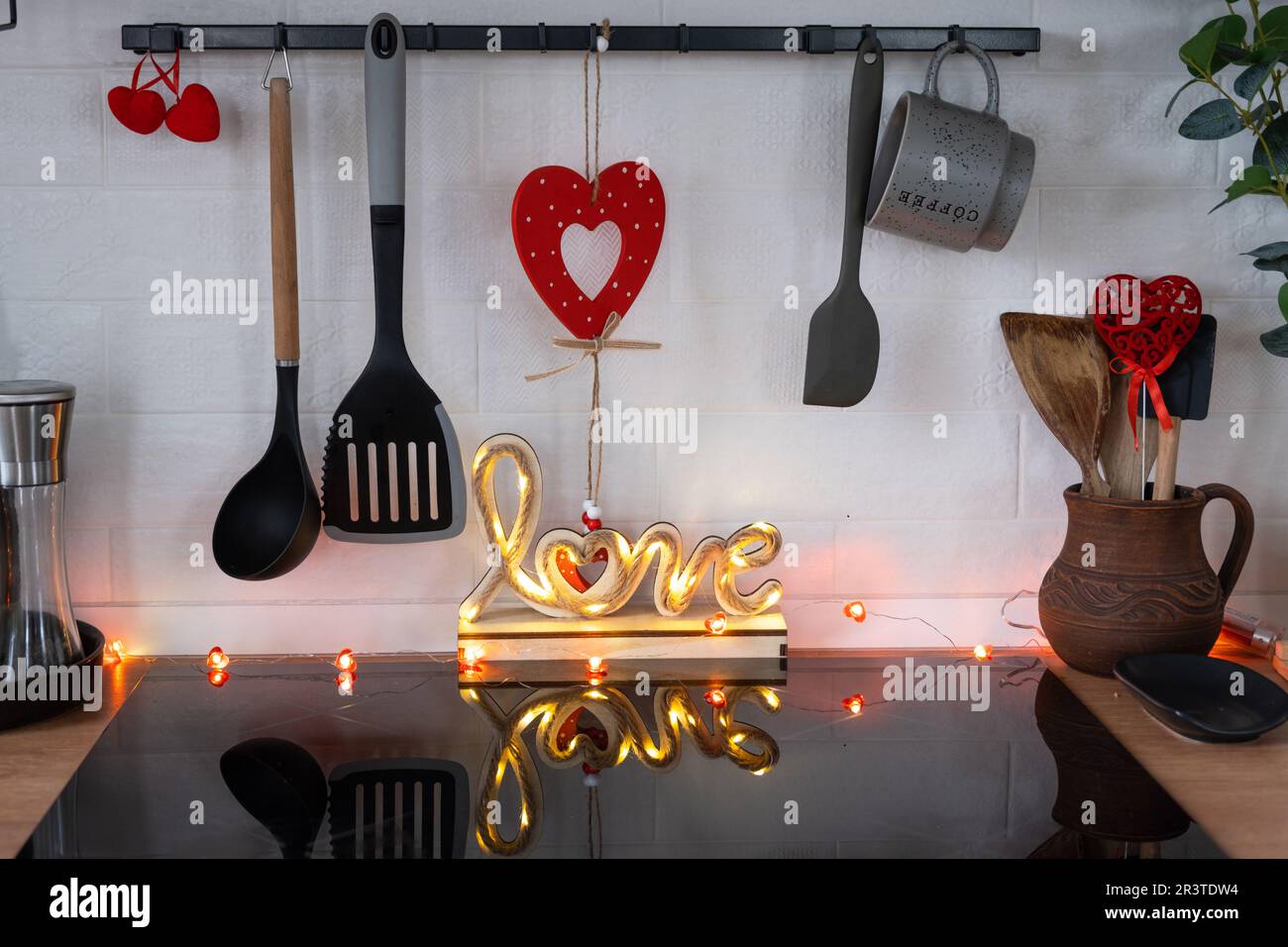 The interior of the kitchen in the house is decorated with red hearts ...