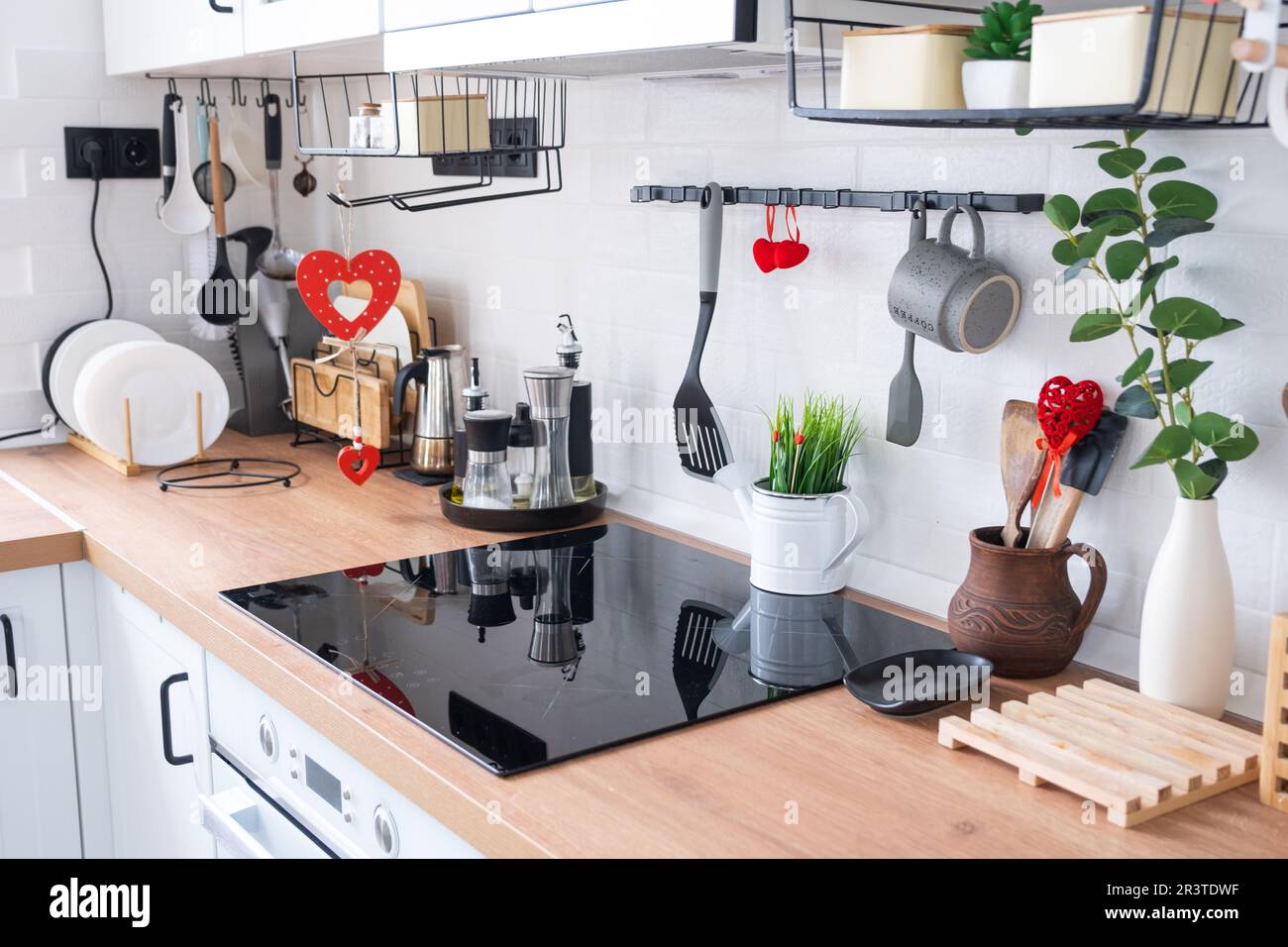 The interior of the kitchen in the house is decorated with red hearts ...