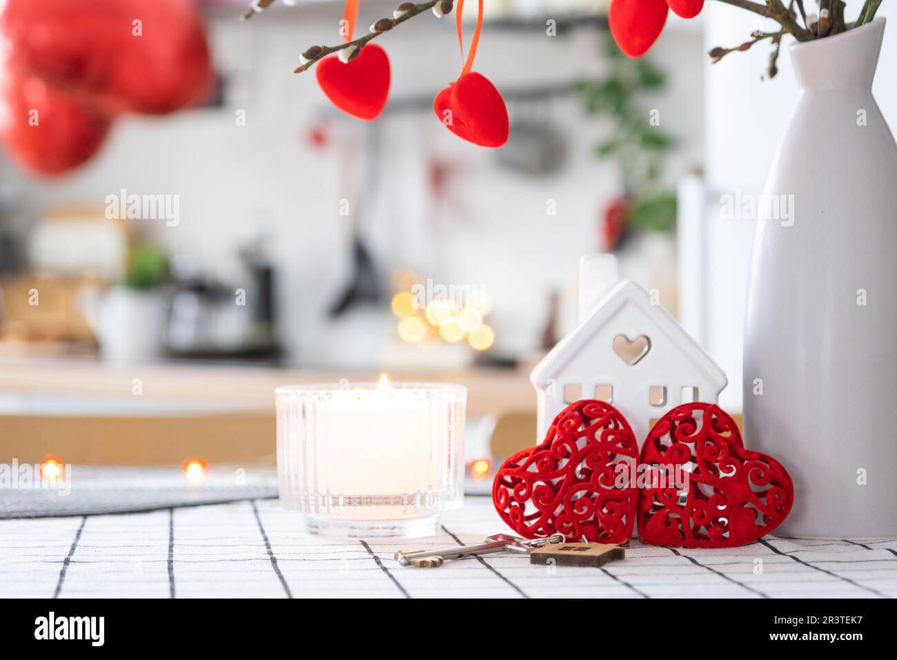 Key to house of cozy home with Valentine decor on table of kitchen ...