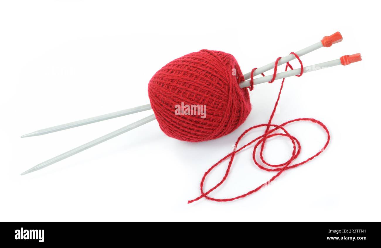 Red ball of yarn with knitting Stock Photo - Alamy
