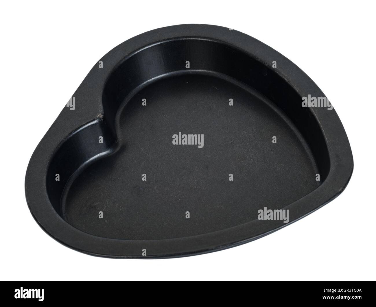 Baking dish in the shape of heart Stock Photo - Alamy