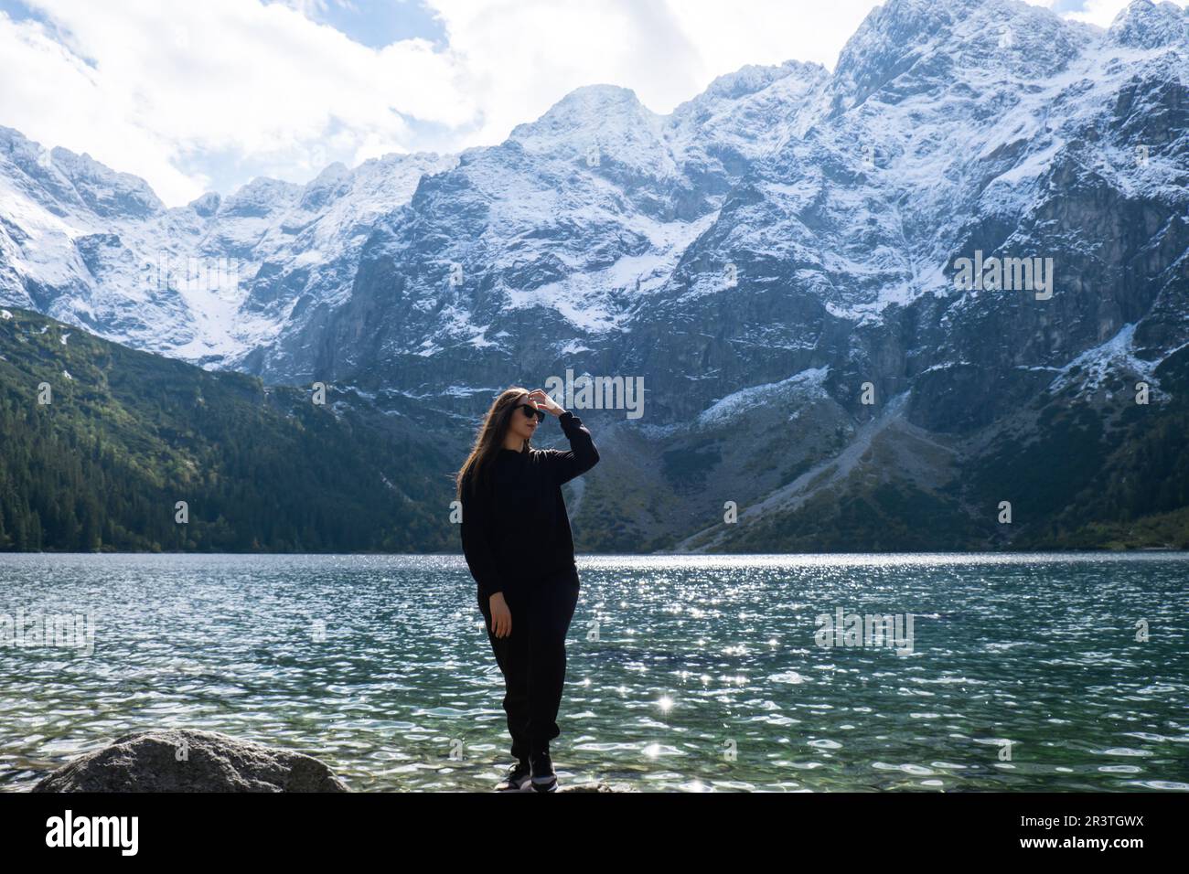 Young woman enjoying nature in Morskie Oko Snowy Mountain Hut in Polish ...