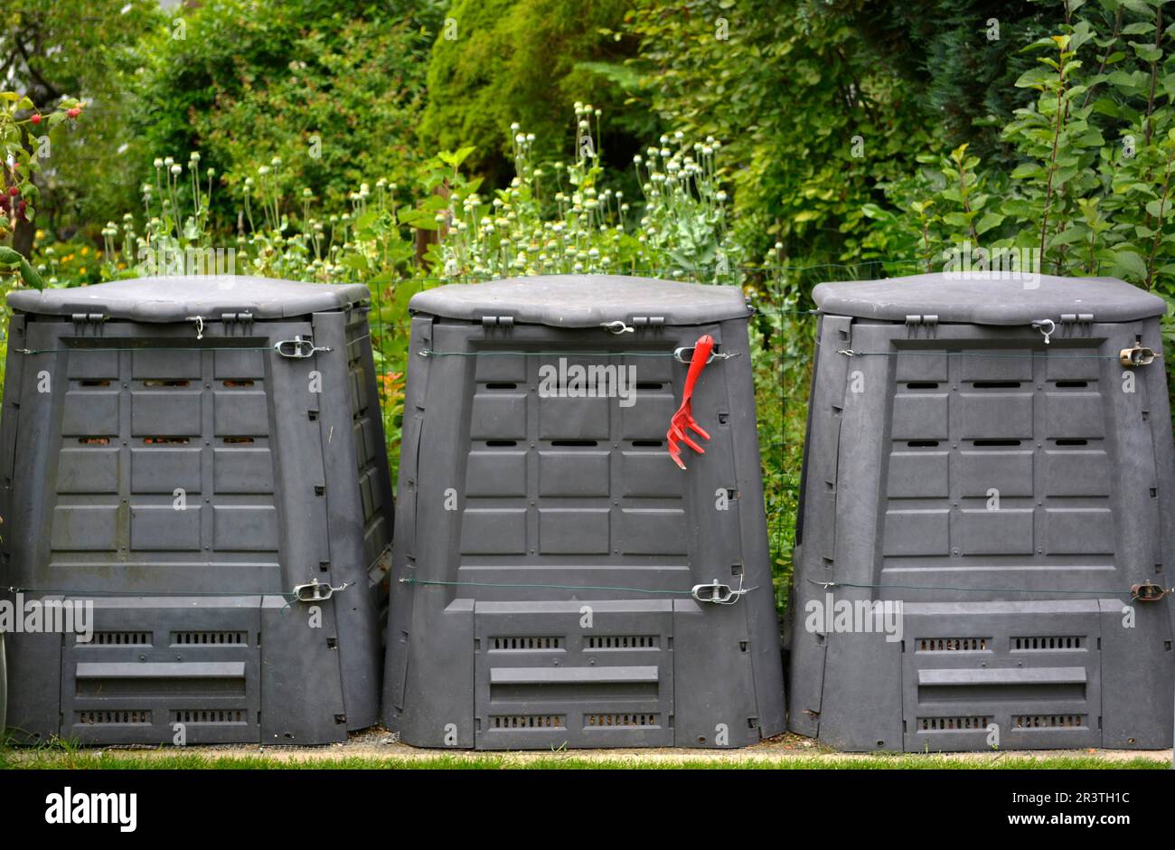 3 Composters in the garden Stock Photo - Alamy