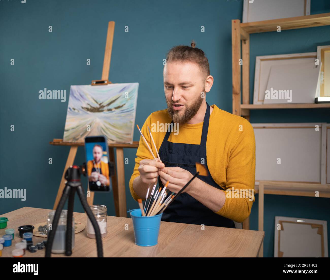 Art school, technology and people concept. Man painter teacher teach ...