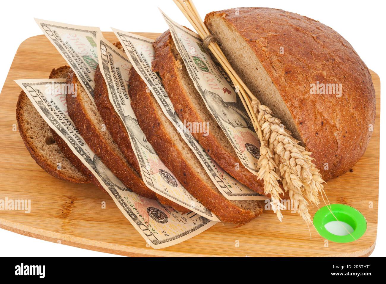Slice bread with money Stock Photo - Alamy