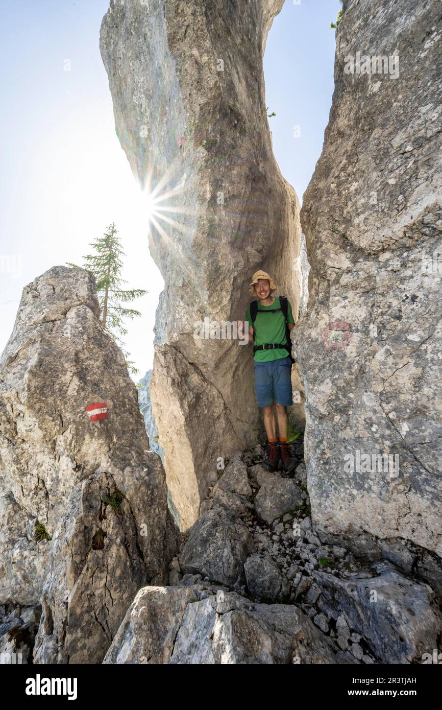 Climbers in a narrow rock passage, on the Mannlsteig, via ferrata on ...