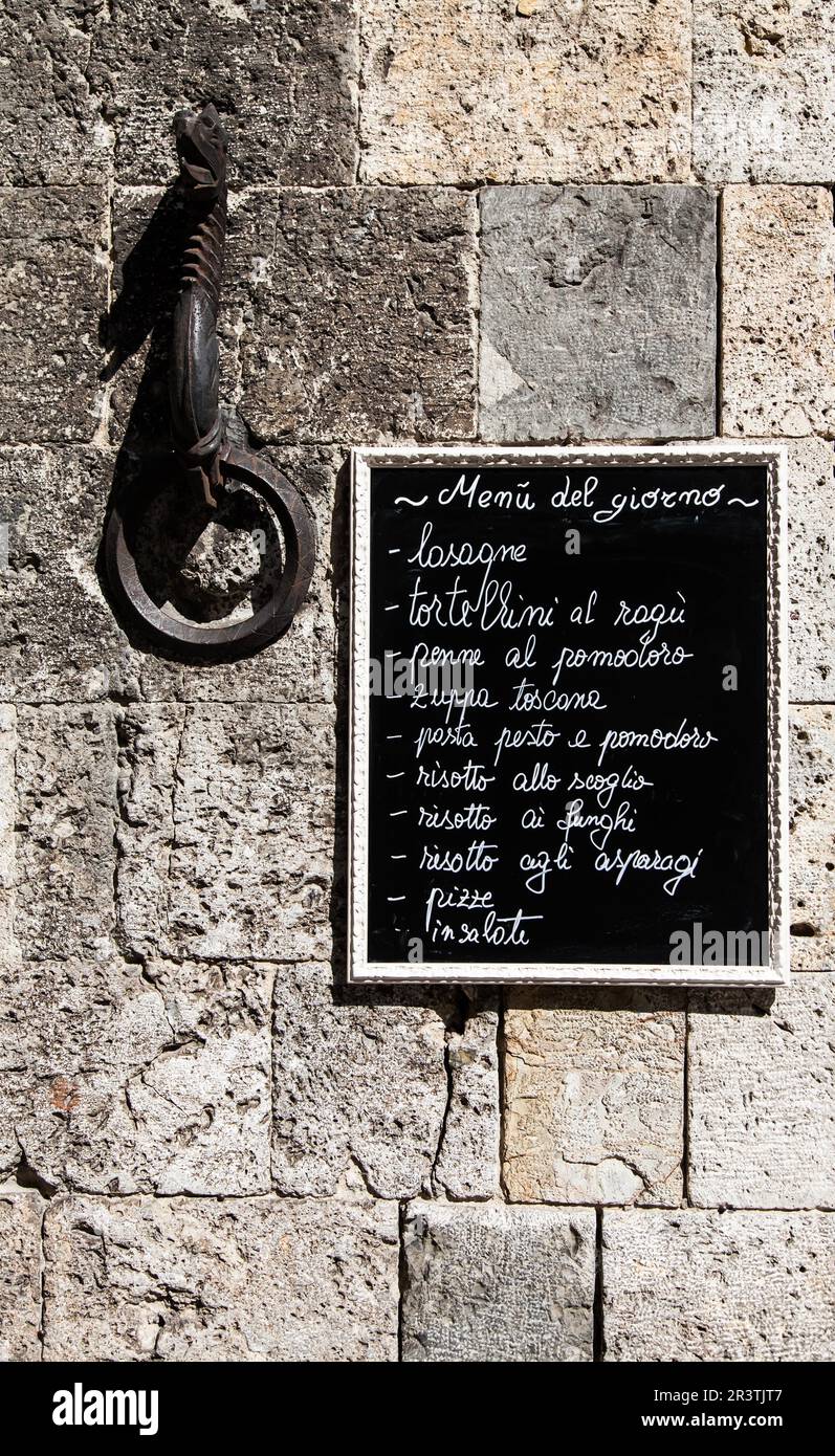 Tuscany, Italy. A turistic menu exposed on a blackboard outside a ...