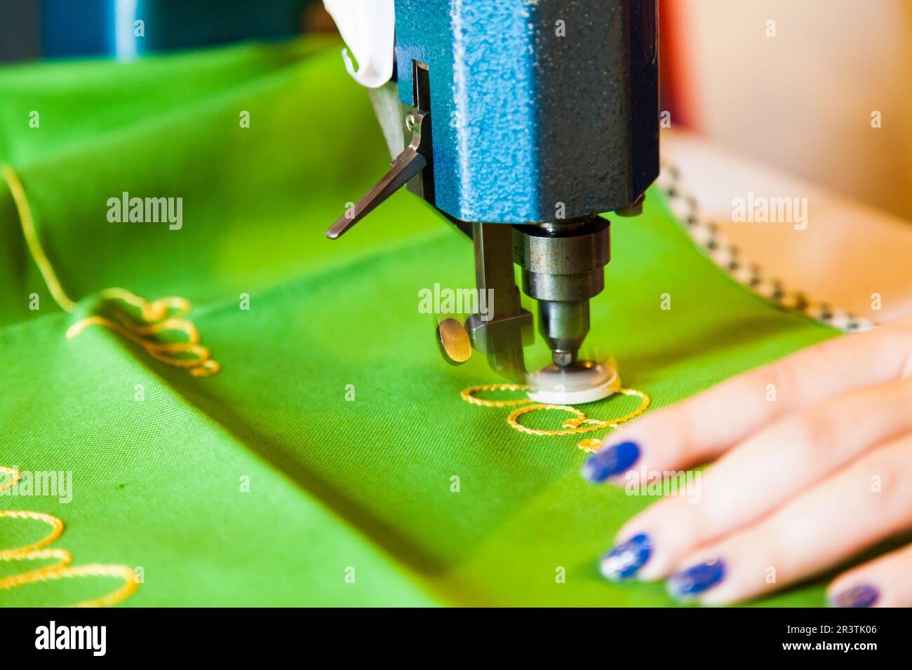Detail of a lady hand at sewing machine Stock Photo - Alamy