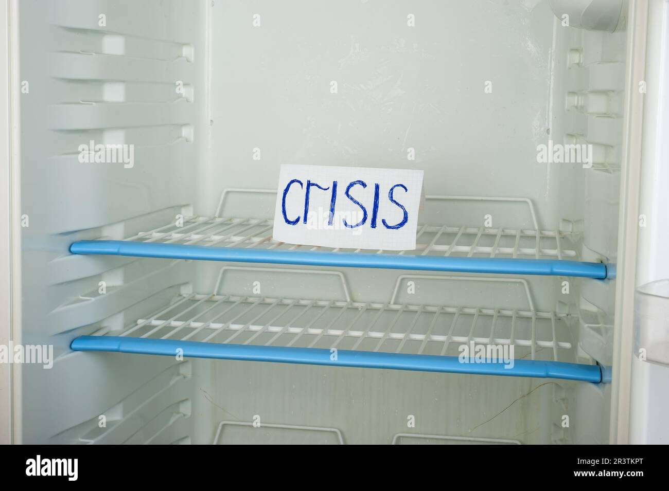 Label the crisis in an empty refrigerator Stock Photo - Alamy