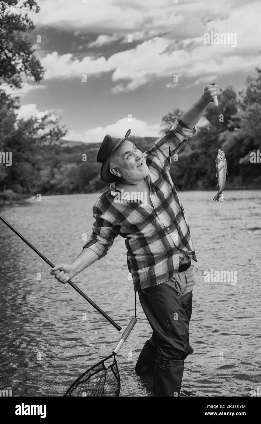 Fisherman using rod flyfishing in mountain river. Fisherman fishing on ...