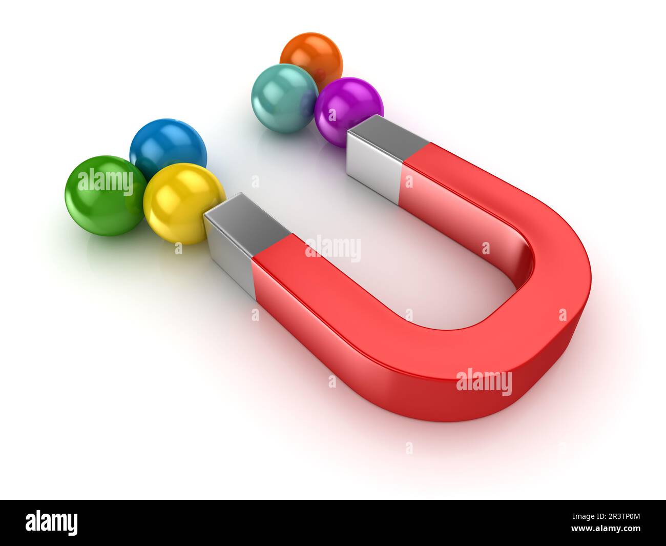 Red magnet and colorful ball Stock Photo - Alamy