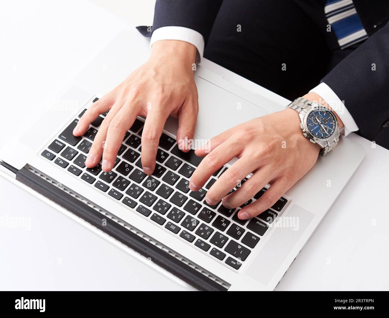 Japanese male businessman operating a personal computer Stock Photo - Alamy