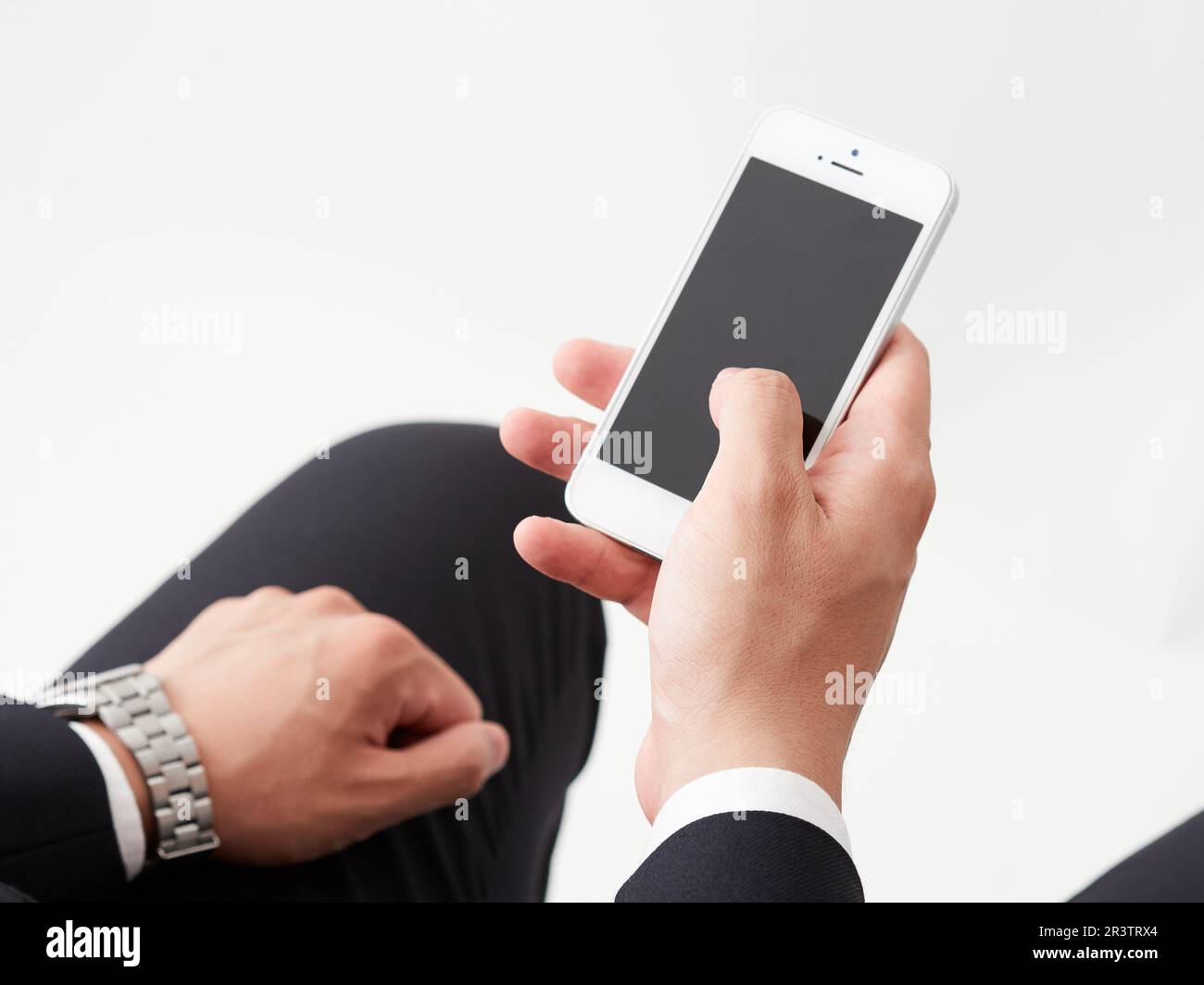 Japanese male businessman operating a smartphone Stock Photo - Alamy