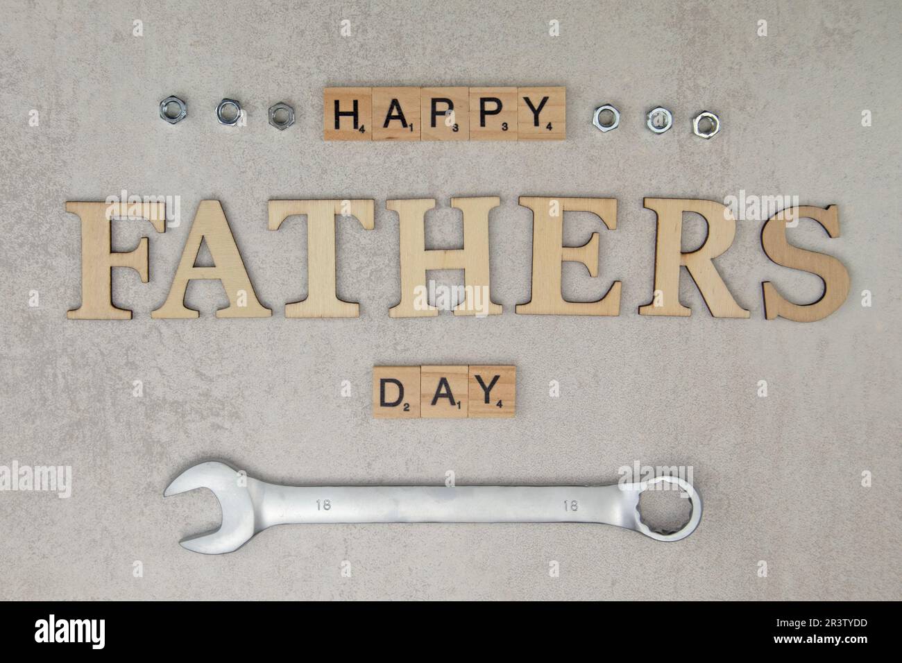 Scrabble happy father's day on textured background. Tools and copy ...
