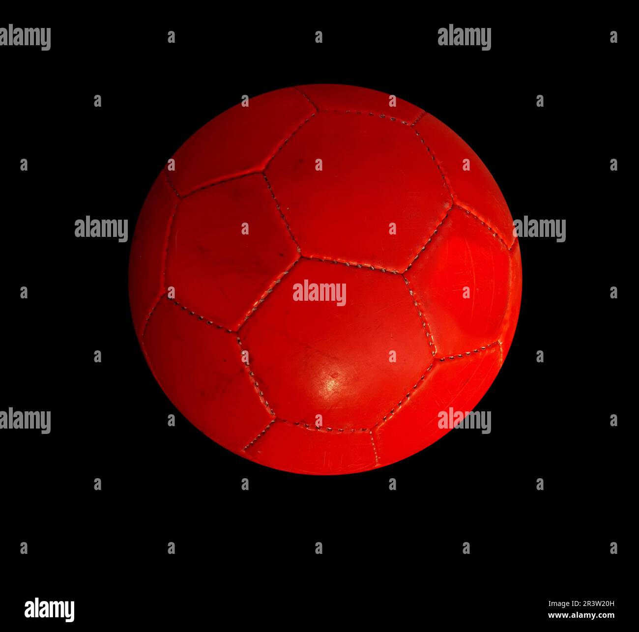 Red soccer ball on the black background Stock Photo - Alamy