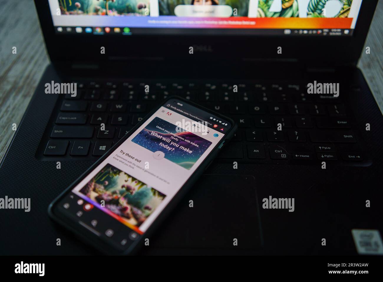 Adobe Firefly on PC and Smartphone screen Stock Photo - Alamy