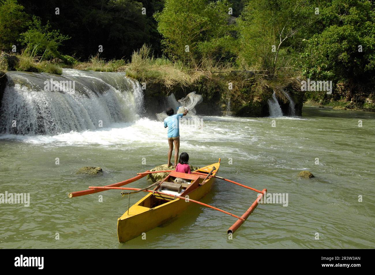 Fisherman casts net, Banca, outrigger boat, Philippines, fishing net ...