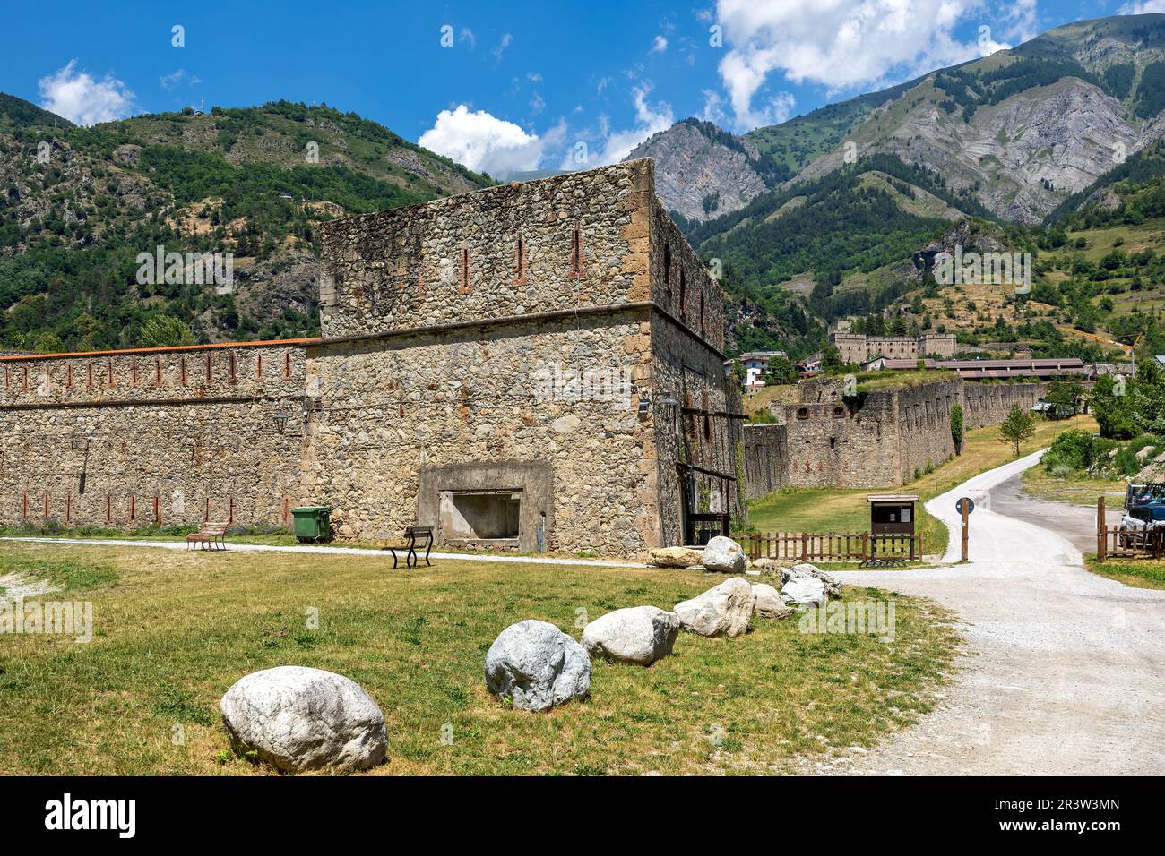 Tower and walls of the old military fort as mountains on background in ...