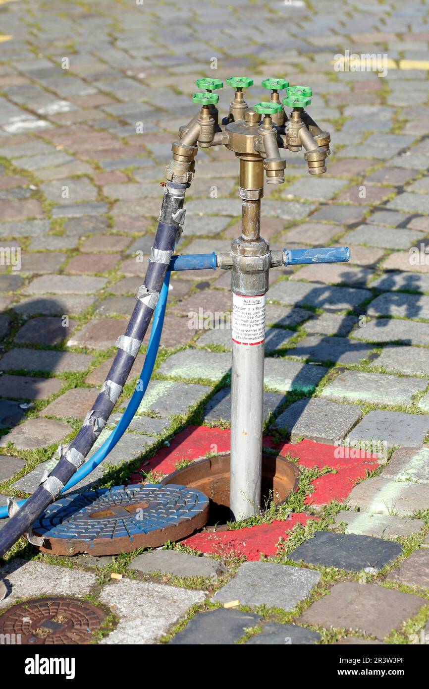Standpipe with water taps at an underground hydrant, Germany Stock ...