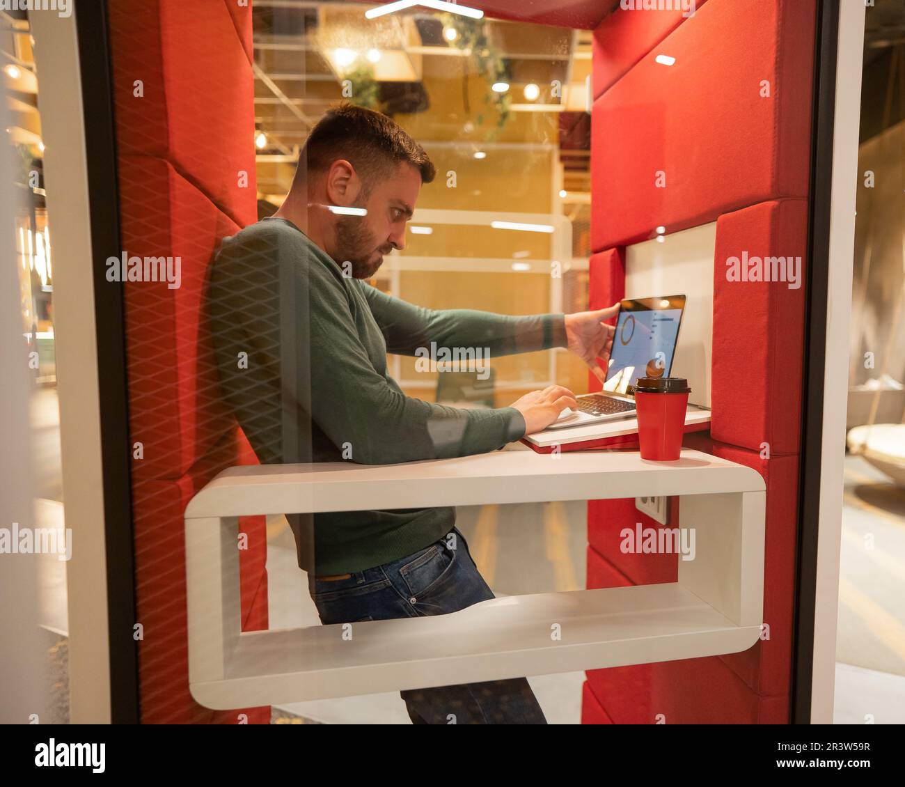 A bearded man in a booth for online negotiations. Privacy booth Stock ...