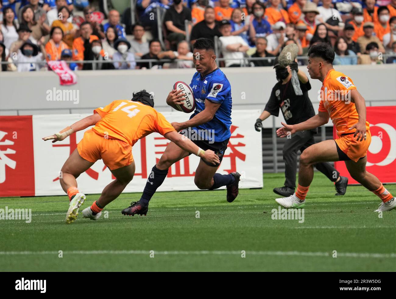 Panasonic Wild Knights' Tomoki Osada runs for scoring a try during the ...