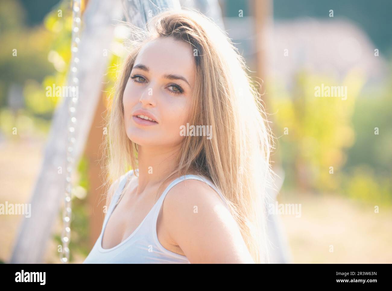 Portrait of beautiful young woman. Young woman on sunny spring day ...