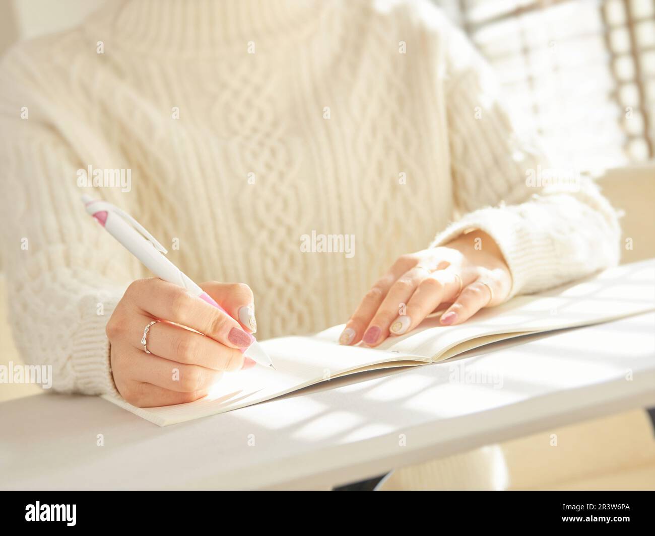 Hands of Asian women doing school assignments Stock Photo - Alamy