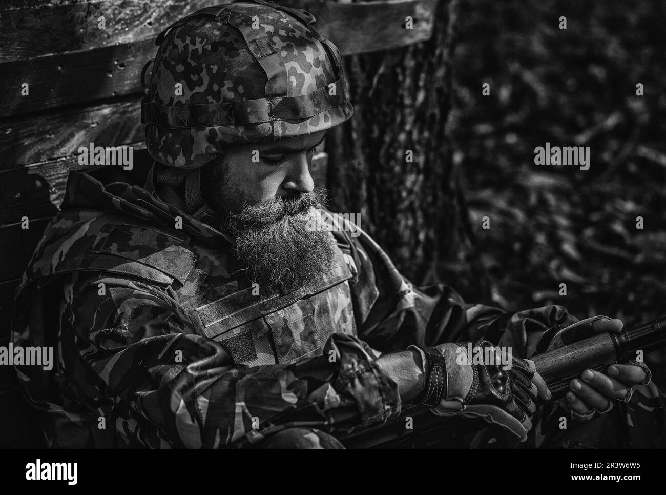 Tired soldier. Army soldier with assault rifle and combat helmet ...