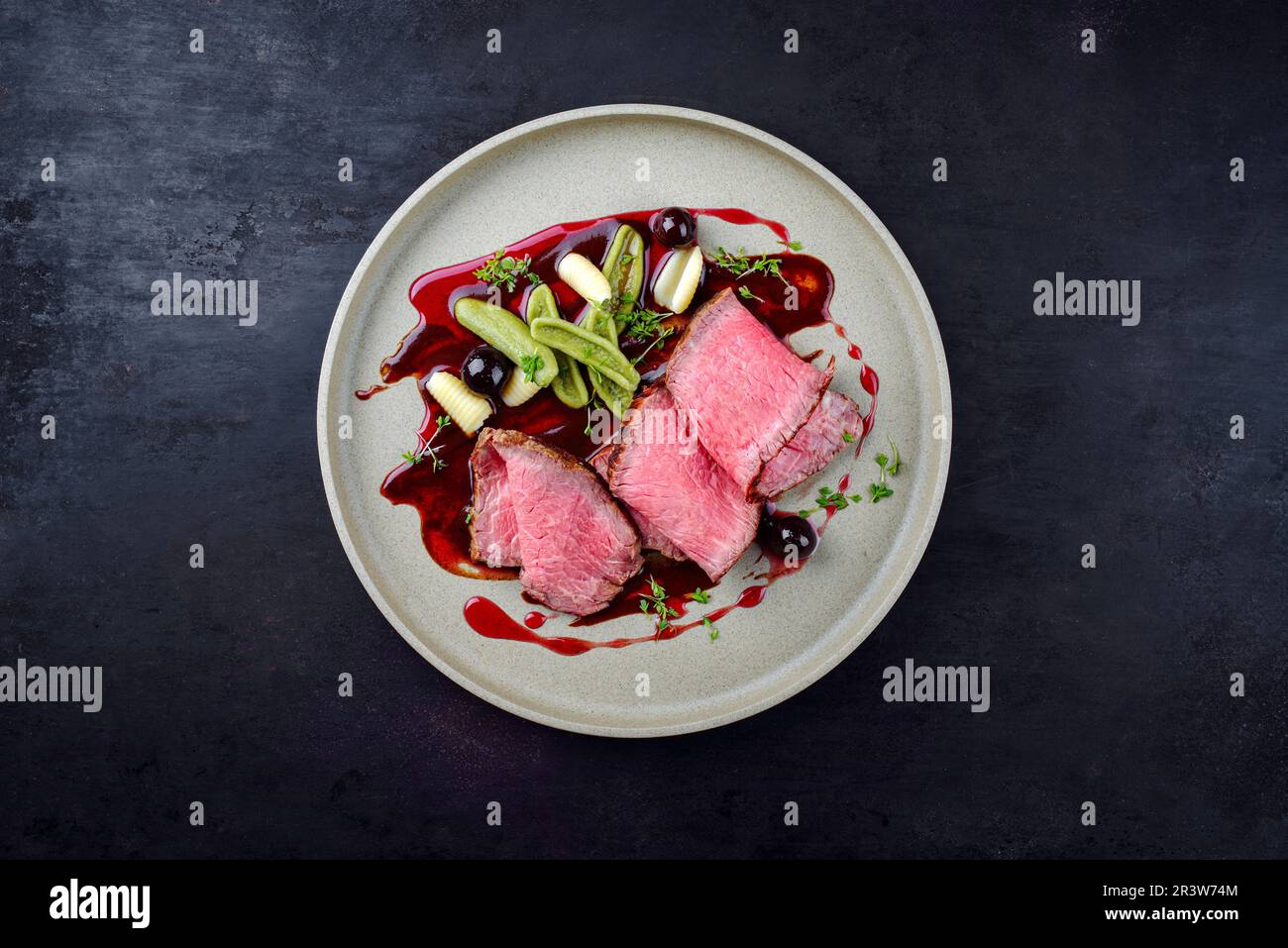 Traditional Italian chianina sliced roast beef with gnocchetti sardi ...