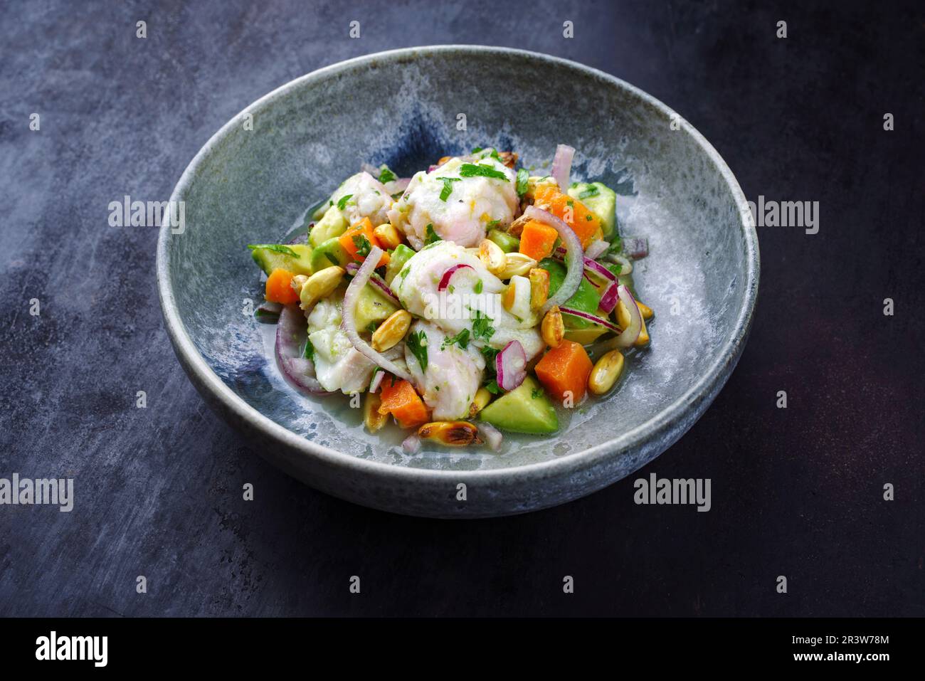 Traditional Peruvian gourmet ceviche sea bass filet piece with sweet ...