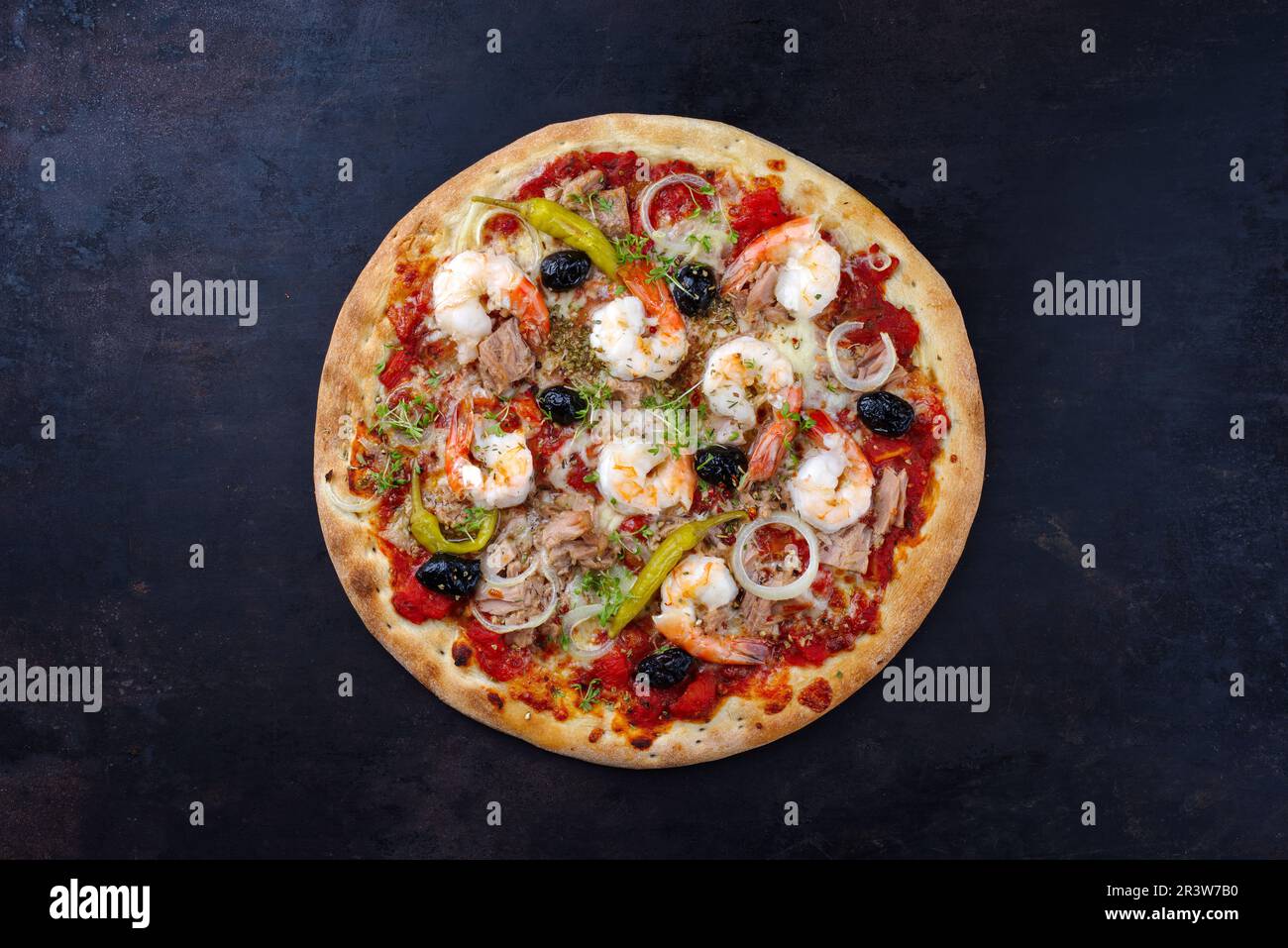 Traditional Italian pizza frutti di mare with king prawns Stock Photo ...