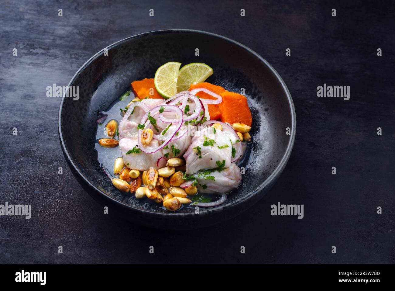 Traditional Peruvian gourmet ceviche sea bass filet piece with sweet ...