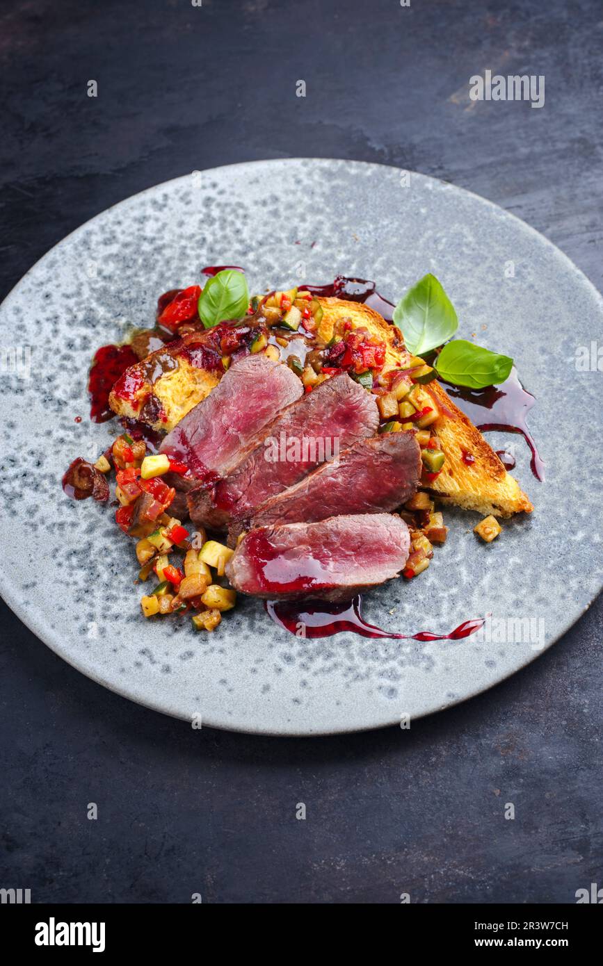 Traditional roasted Italian panettone tagliata di manzo with sliced ...